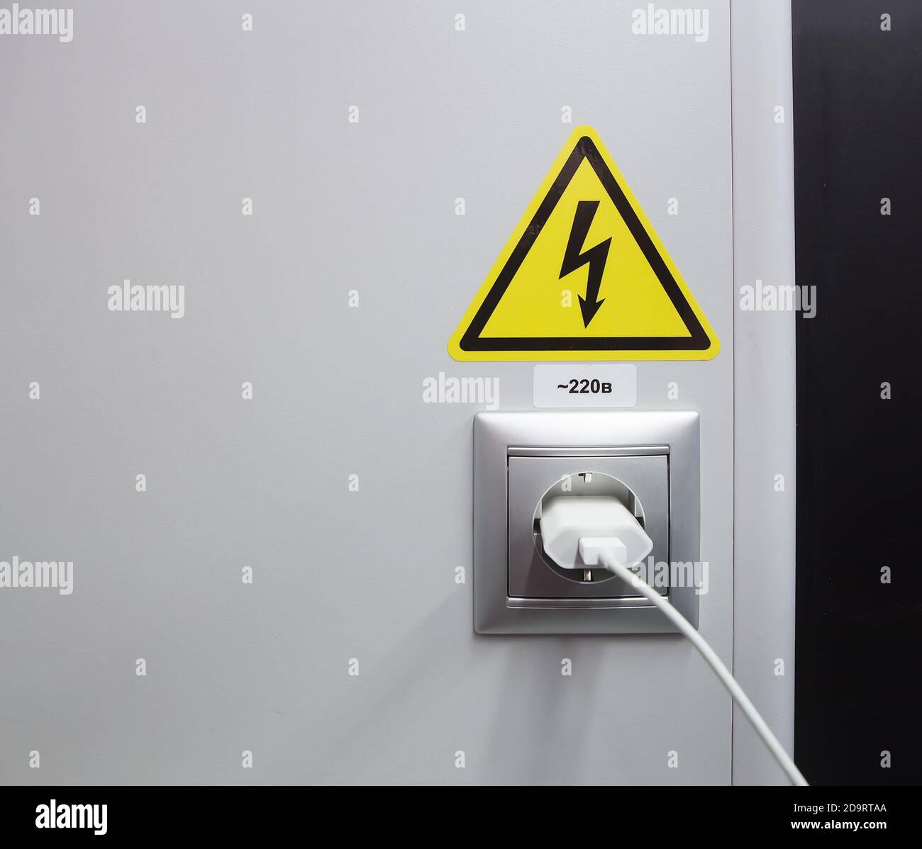 electrical socket and a plug on the wall. Close-up Stock Photo - Alamy
