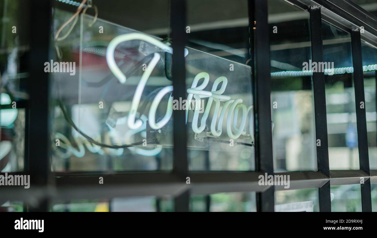 Lateral View of a Blue Tattoo Light Sign from a Barber Shop Tattoo ...