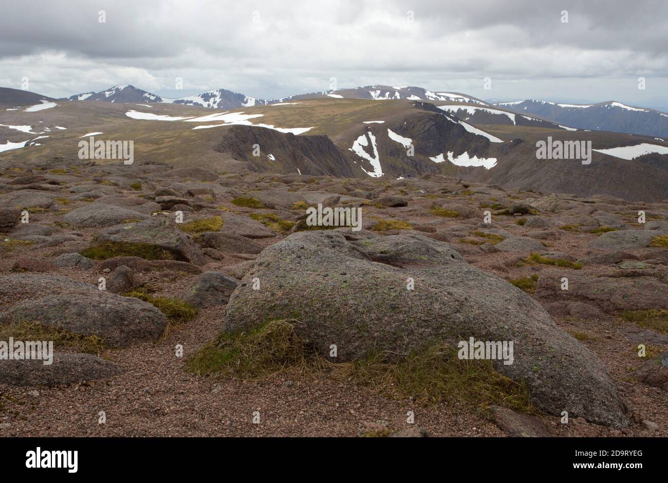 View of mountains and boulder fields from summit of Cairn Gorm ...