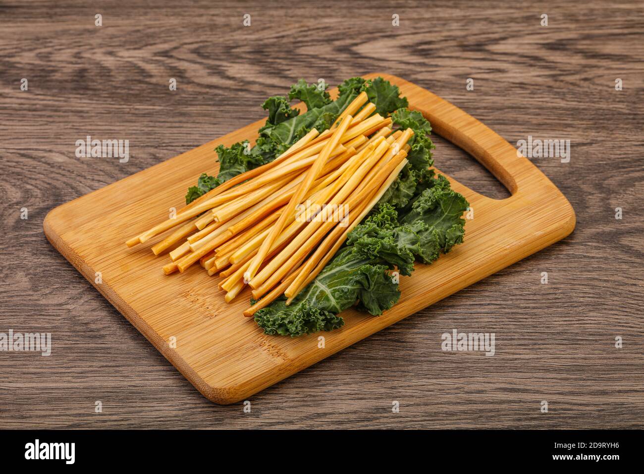 Caucasian Chechel cheese sticks over board Stock Photo - Alamy
