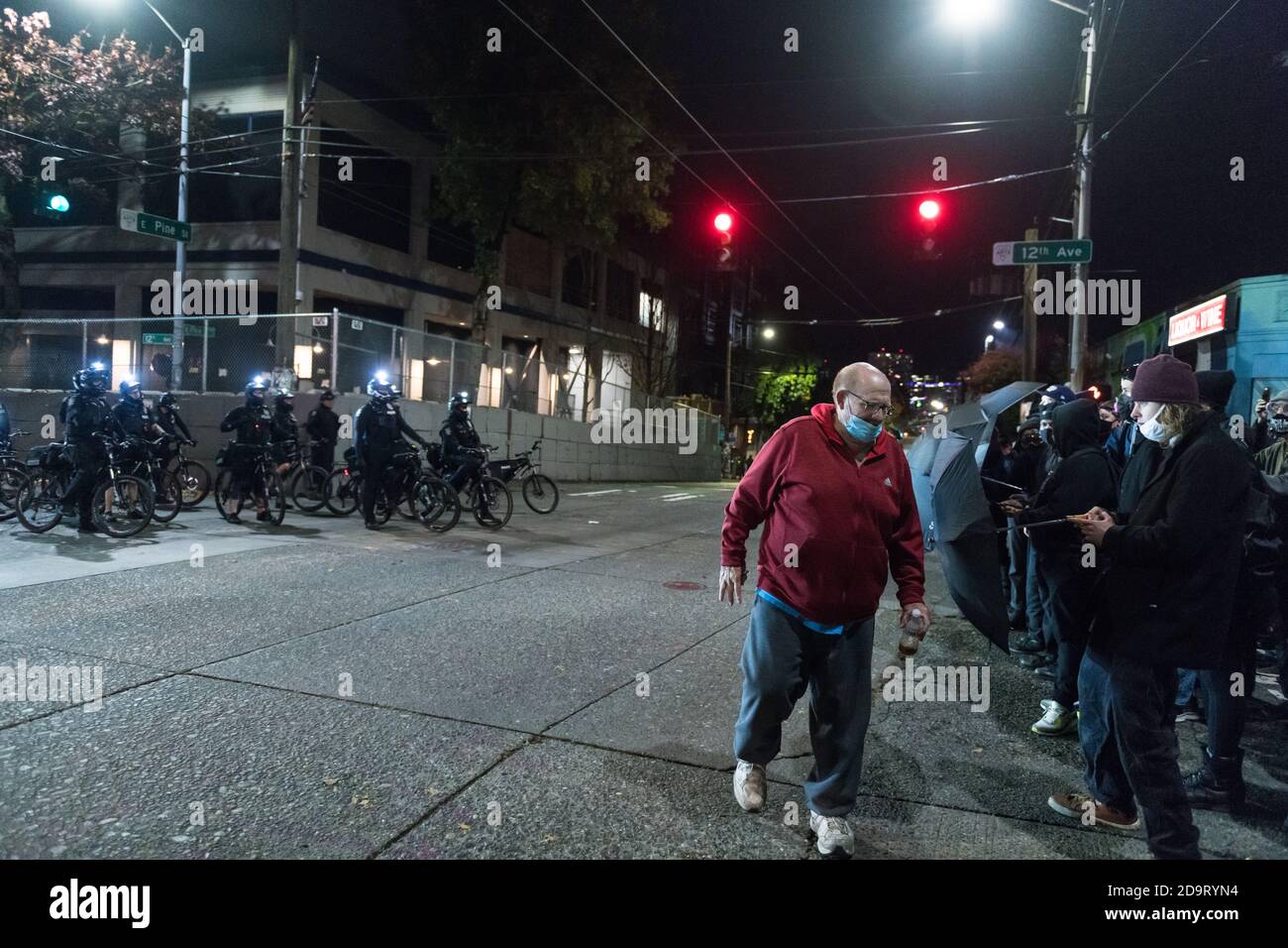 Seattle, USA. 5th Nov, 2020. Late in the night protestors police face ...