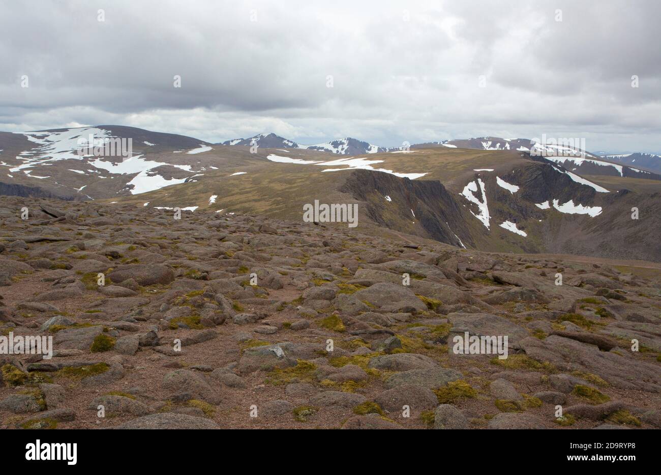 View of mountains and boulder fields from summit of Cairn Gorm ...