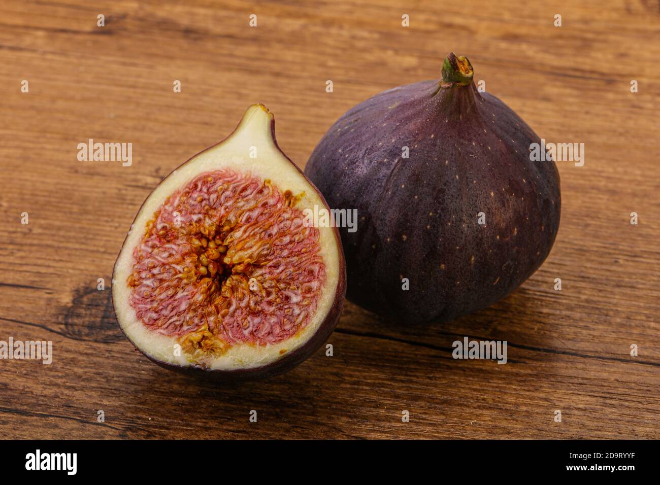 Sweet purple slice of fig fruit Stock Photo - Alamy