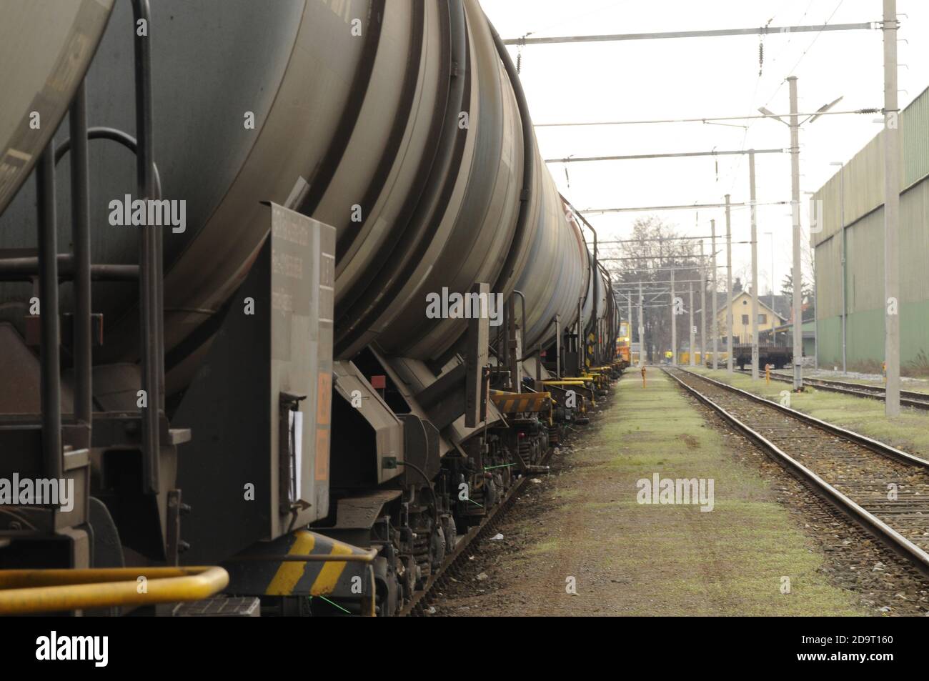 Tank car on the rails standing at the train station Stock Photo - Alamy