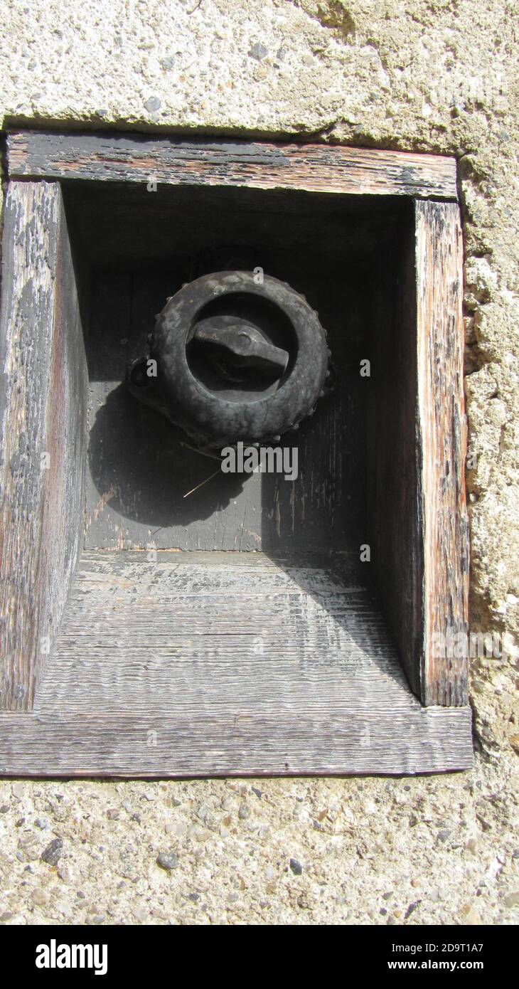 a black and vintage power switch in a wall of a building Stock Photo ...