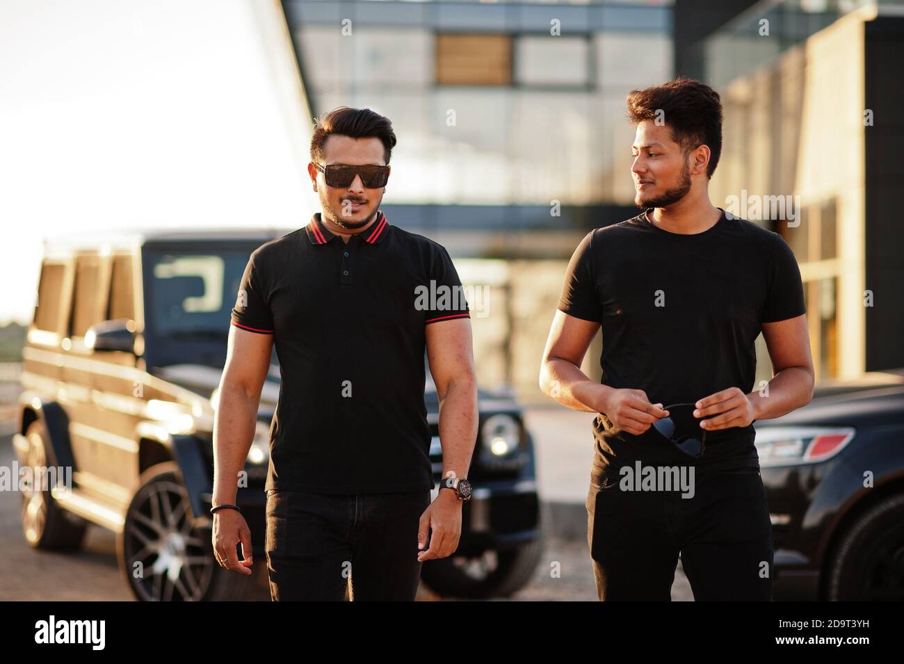 Two asian brothers man wear on all black posed near suv cars Stock ...