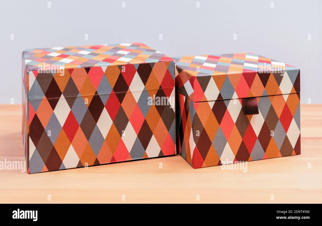 Boxes with multi-colored diamond-shaped pattern for gift wrapping Stock ...