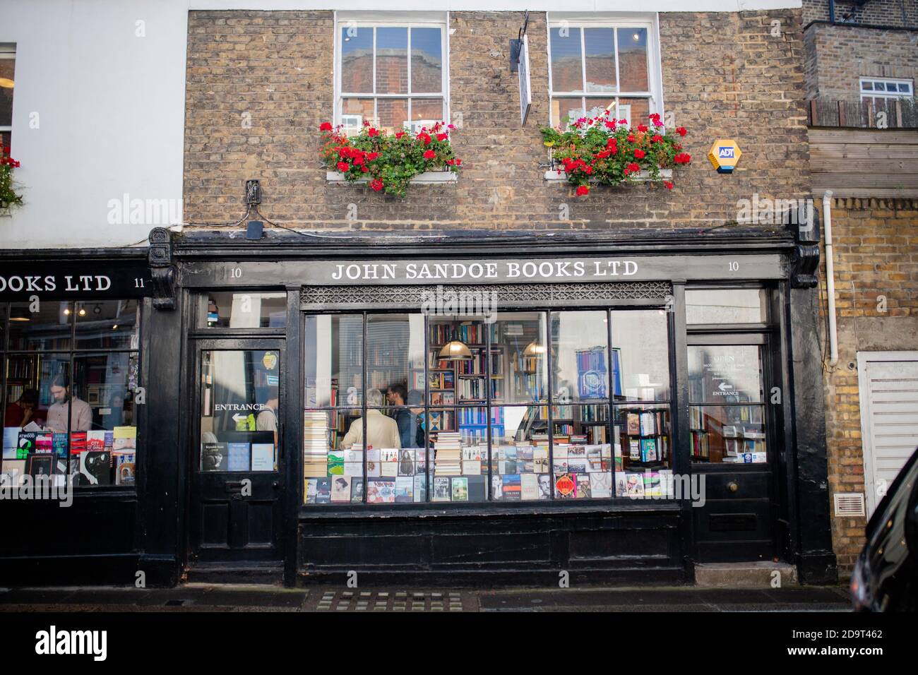 Landscape View of a Black Bookstore on the First Floor of a Red Brick ...