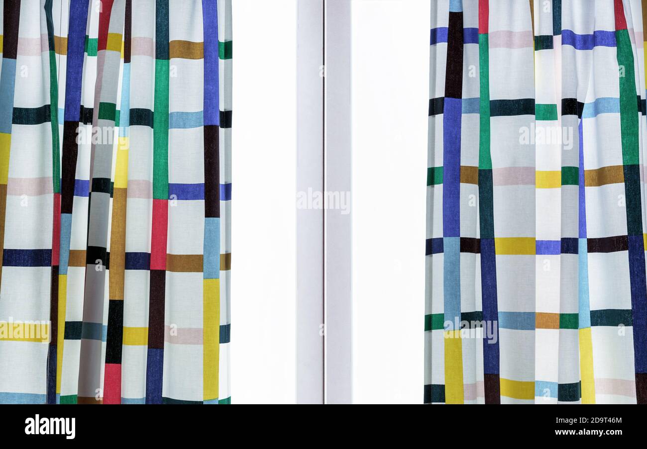 Cotton curtains with multi-colored checks on the window in the children ...