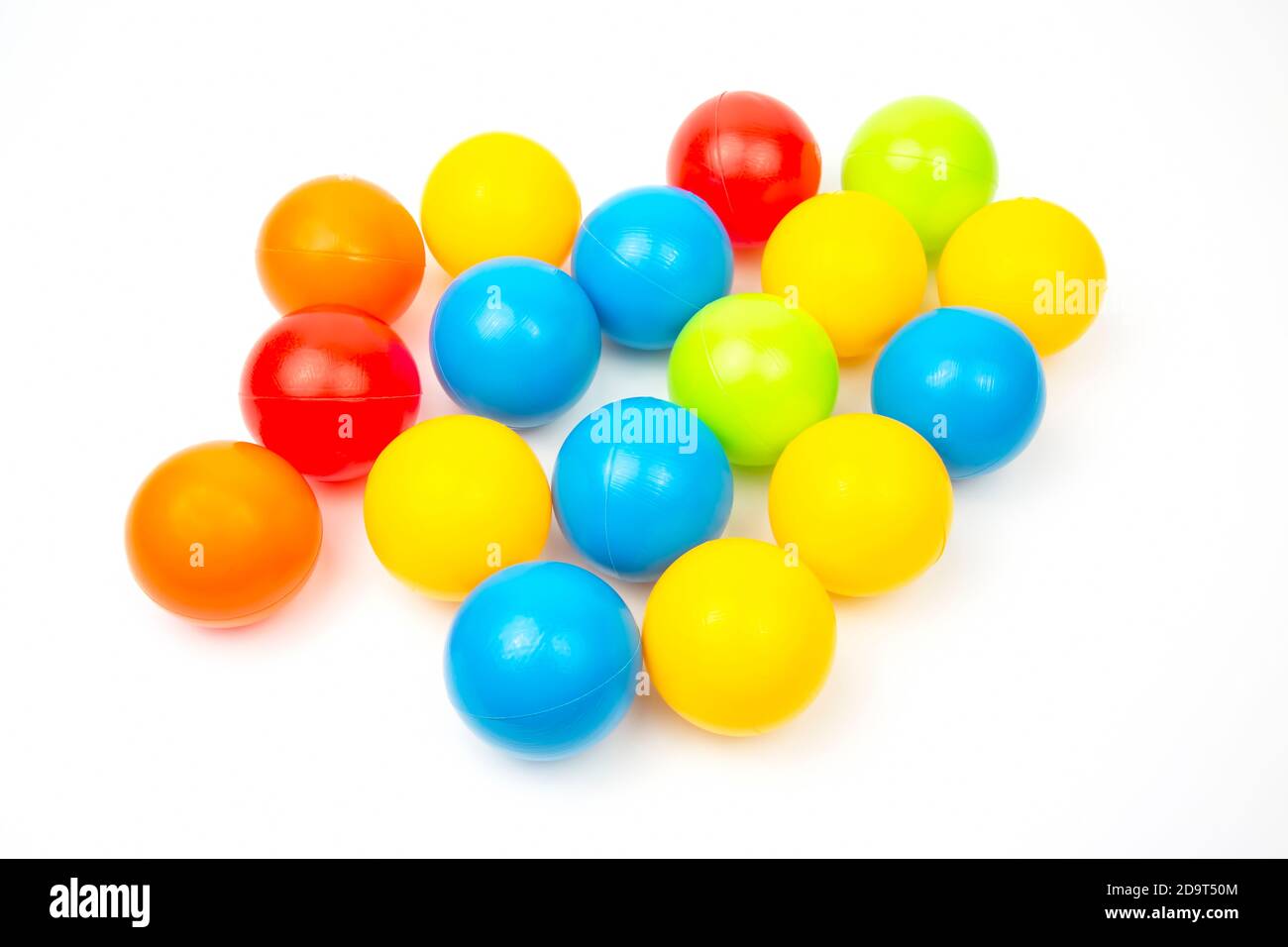 Colored plastic balls on white background. leisure and game items ...