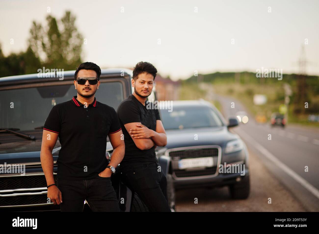 Two asian brothers man wear on all black posed near suv cars Stock ...