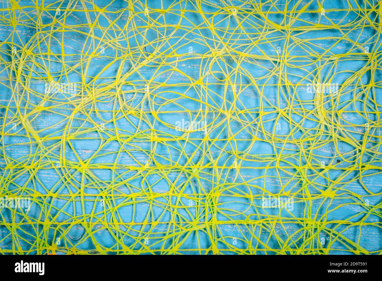 Abstract background of yellow threads on blue Stock Photo - Alamy