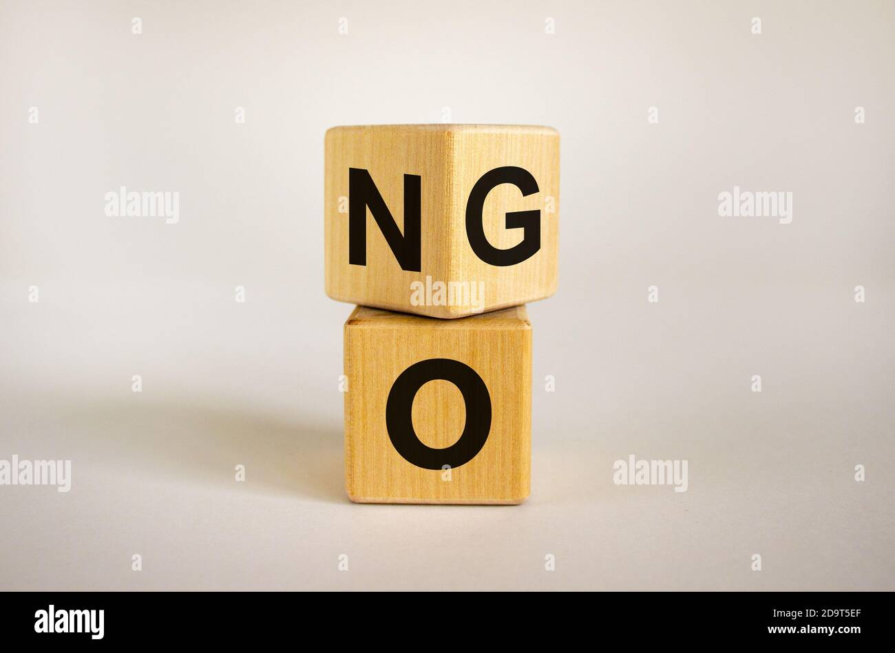 Fliped cube, changes the word NO to GO. Beautiful white background ...