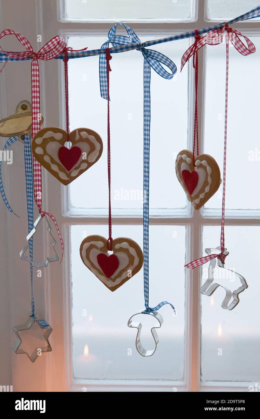 Hanging hearts and cookie cutters at the window UK USE ONLY/EMAIL TO ...
