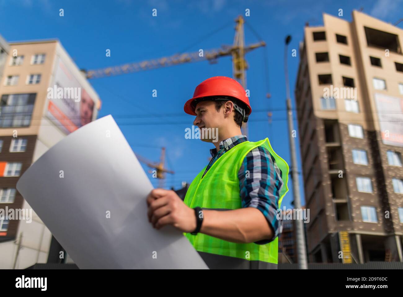 portrait of handsome young man architect on a building industry ...