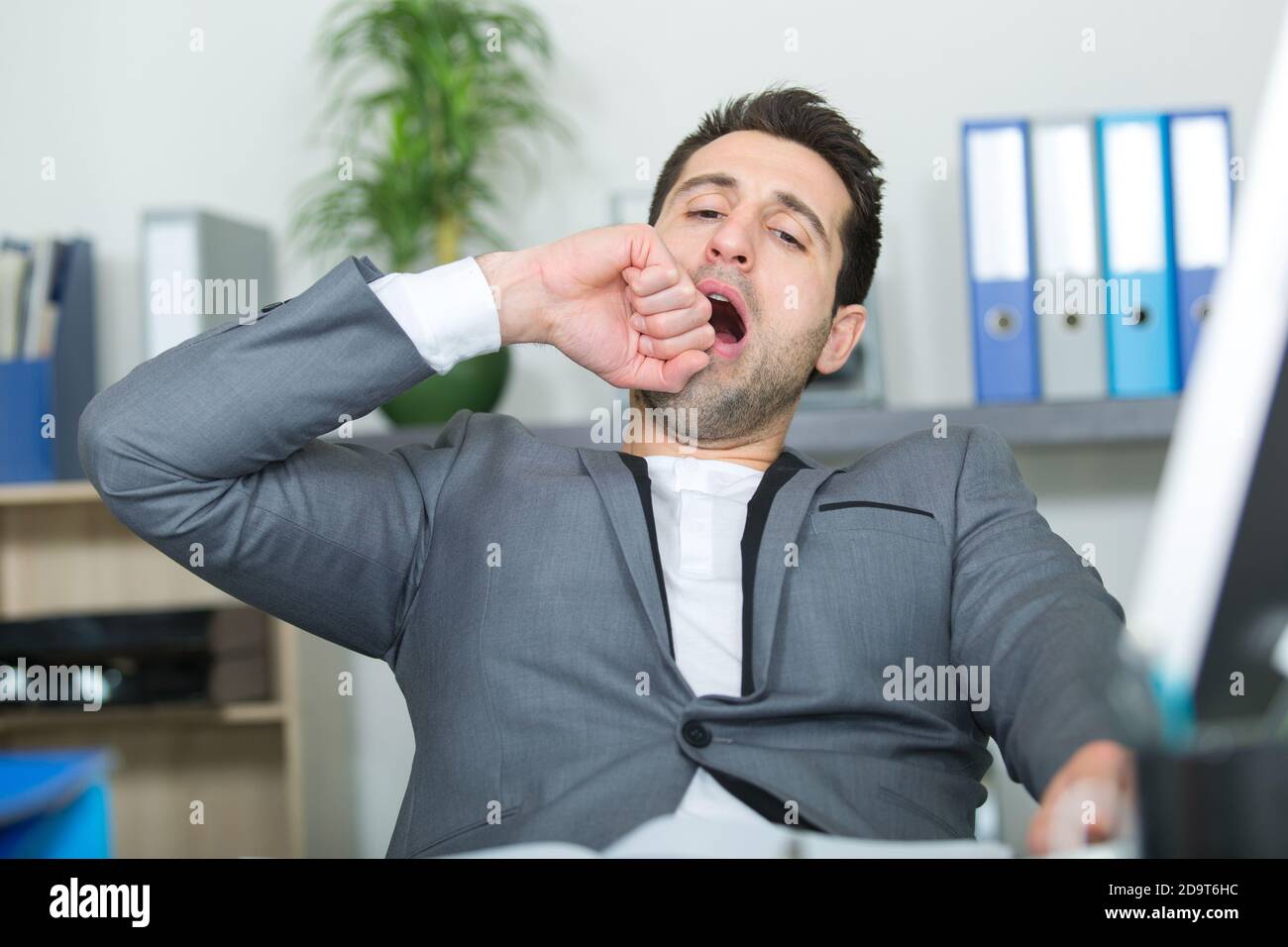 tired worker man in the office Stock Photo - Alamy