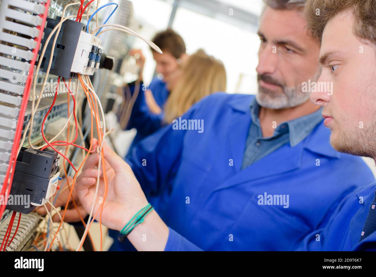 students and teacher with cables and wires Stock Photo - Alamy