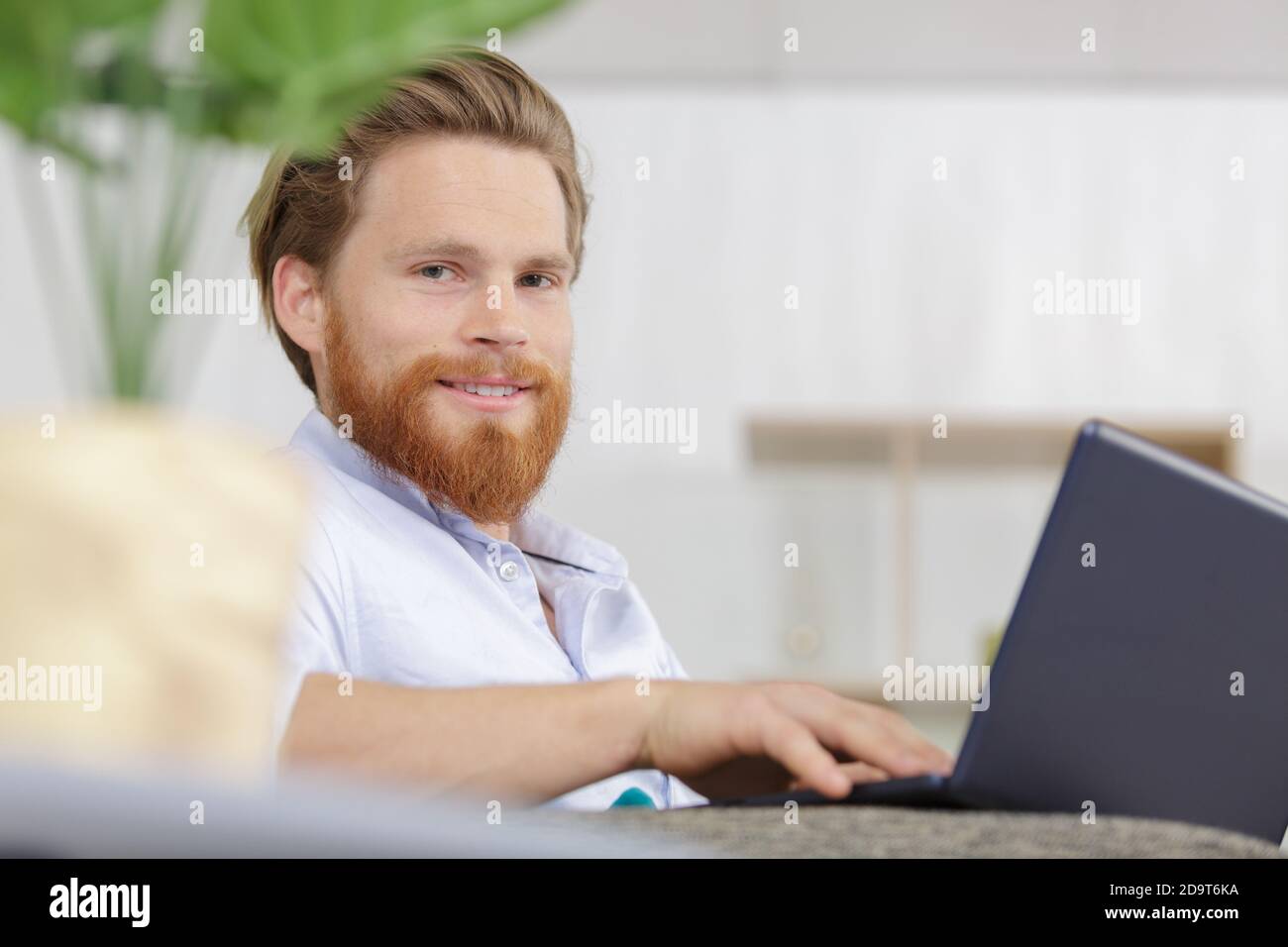 joyful cute guy is laboring with pleasure Stock Photo - Alamy