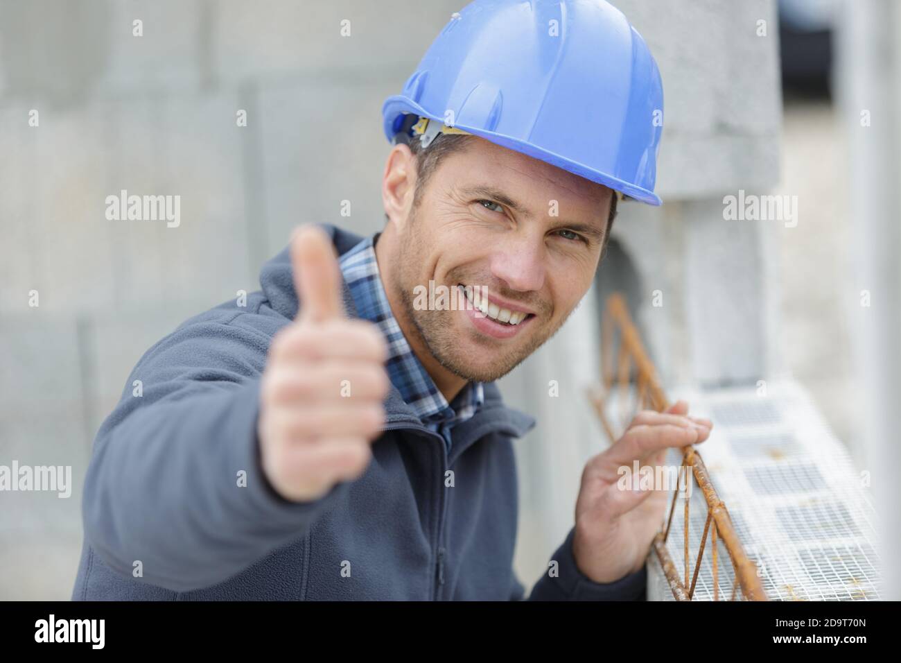 happy builder man laughing and making thumbs up at camera Stock Photo ...