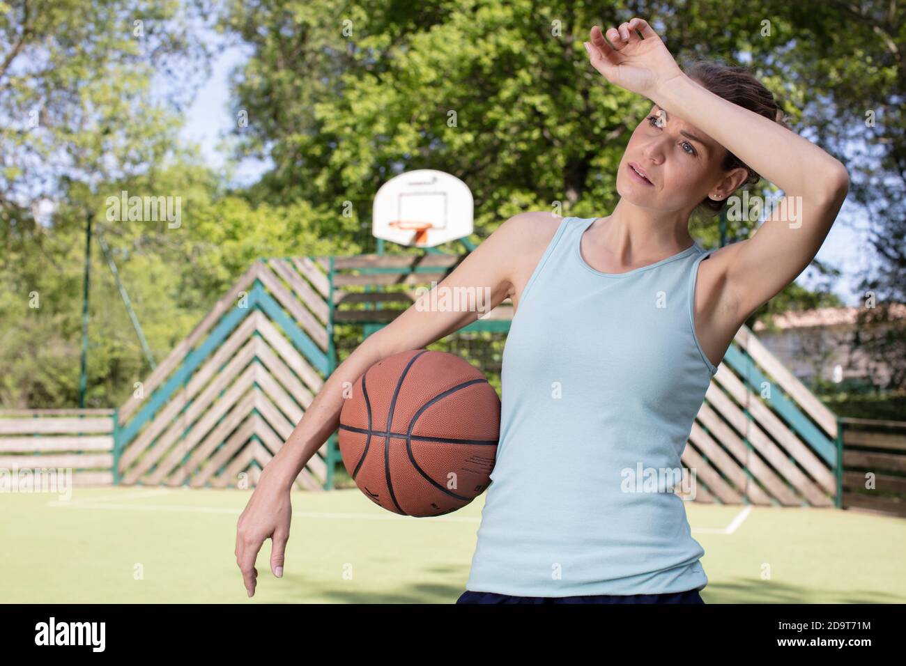 female basketball player having a break Stock Photo - Alamy