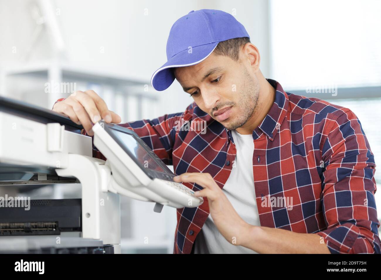 man is checking the printer Stock Photo - Alamy