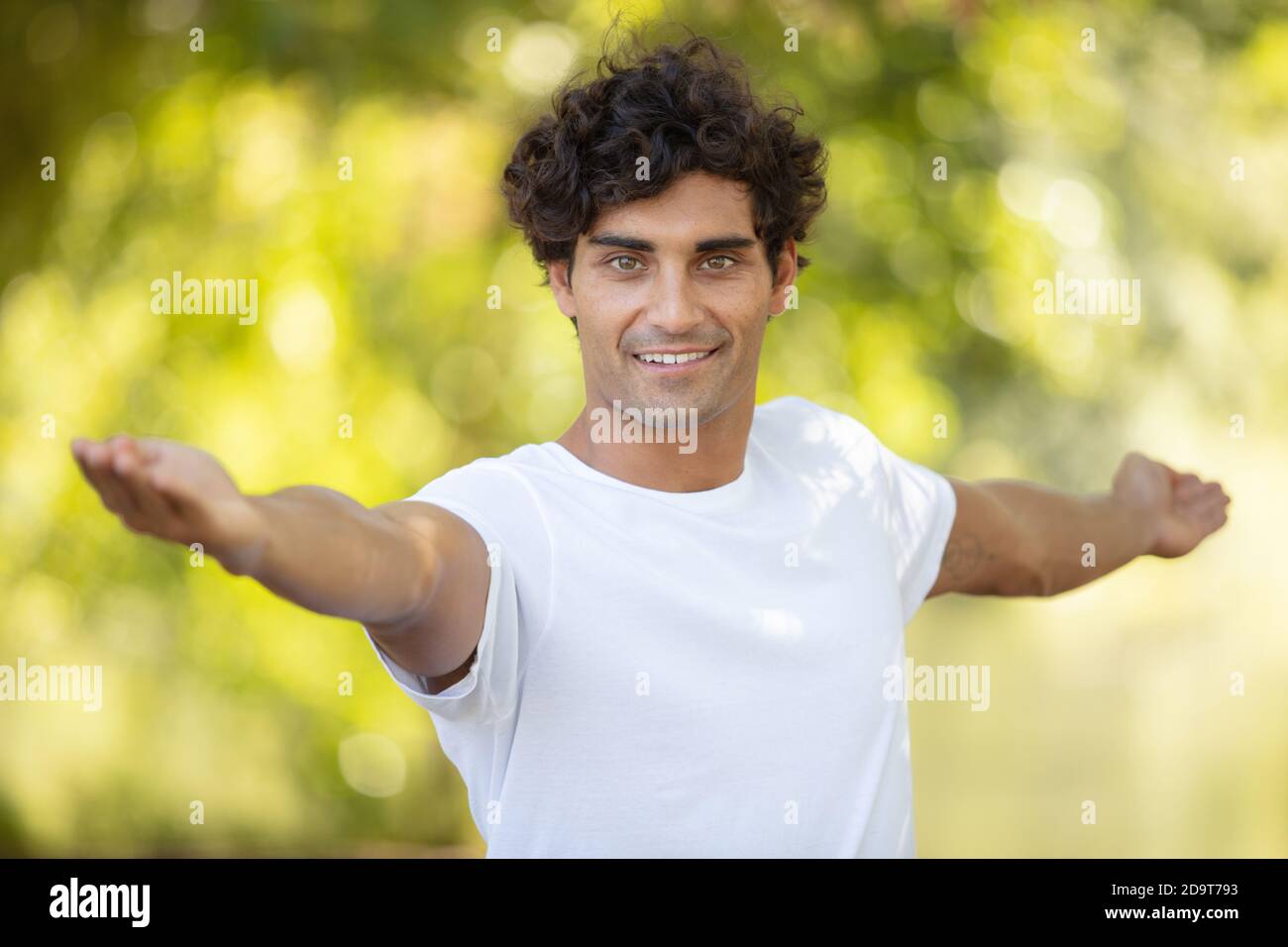 confident muscular man stretching his arms Stock Photo - Alamy