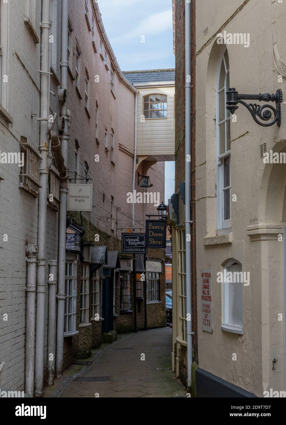 a narrow alleyway or lane full of small independent shops and retail ...