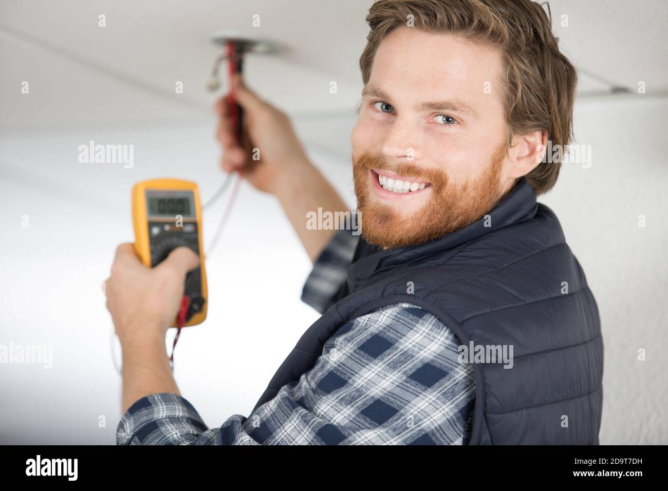 Technician repairing wall light hi-res stock photography and images - Alamy