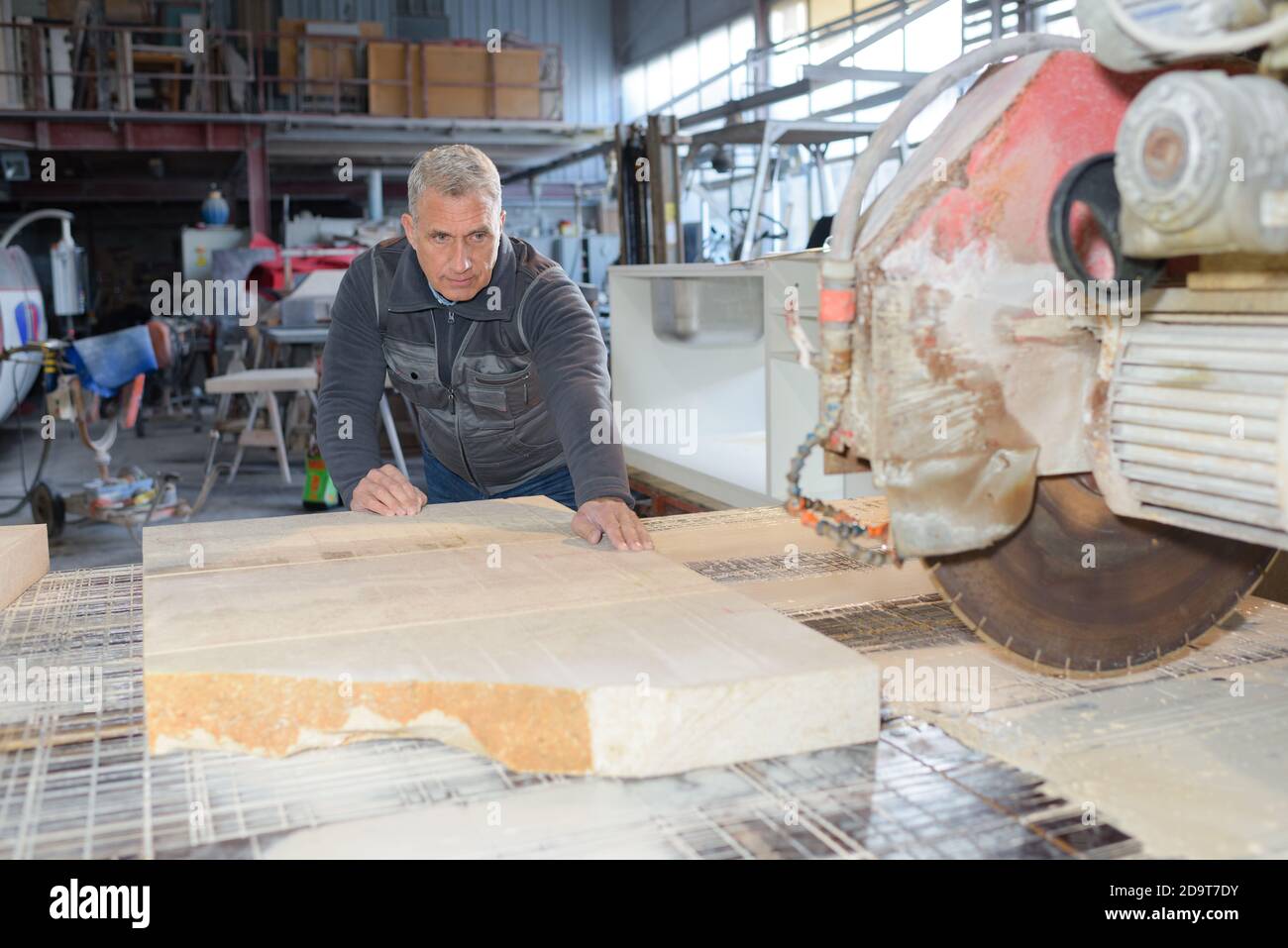 stoneworker taking mesurement Stock Photo - Alamy