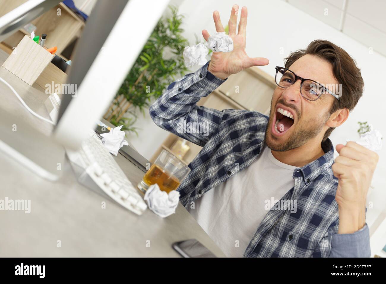 businessman employee drinking in the office at desk Stock Photo - Alamy