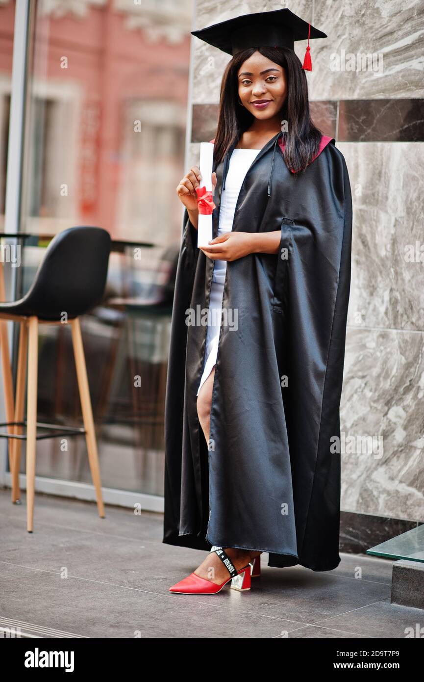 Young female african american student with diploma poses outdoors Stock ...