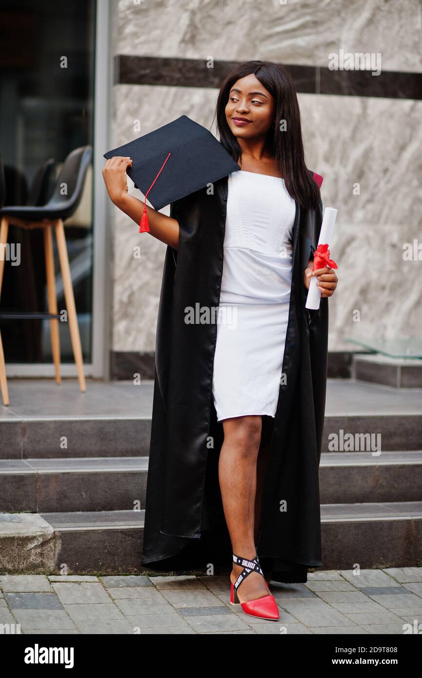 Young female african american student with diploma poses outdoors Stock ...