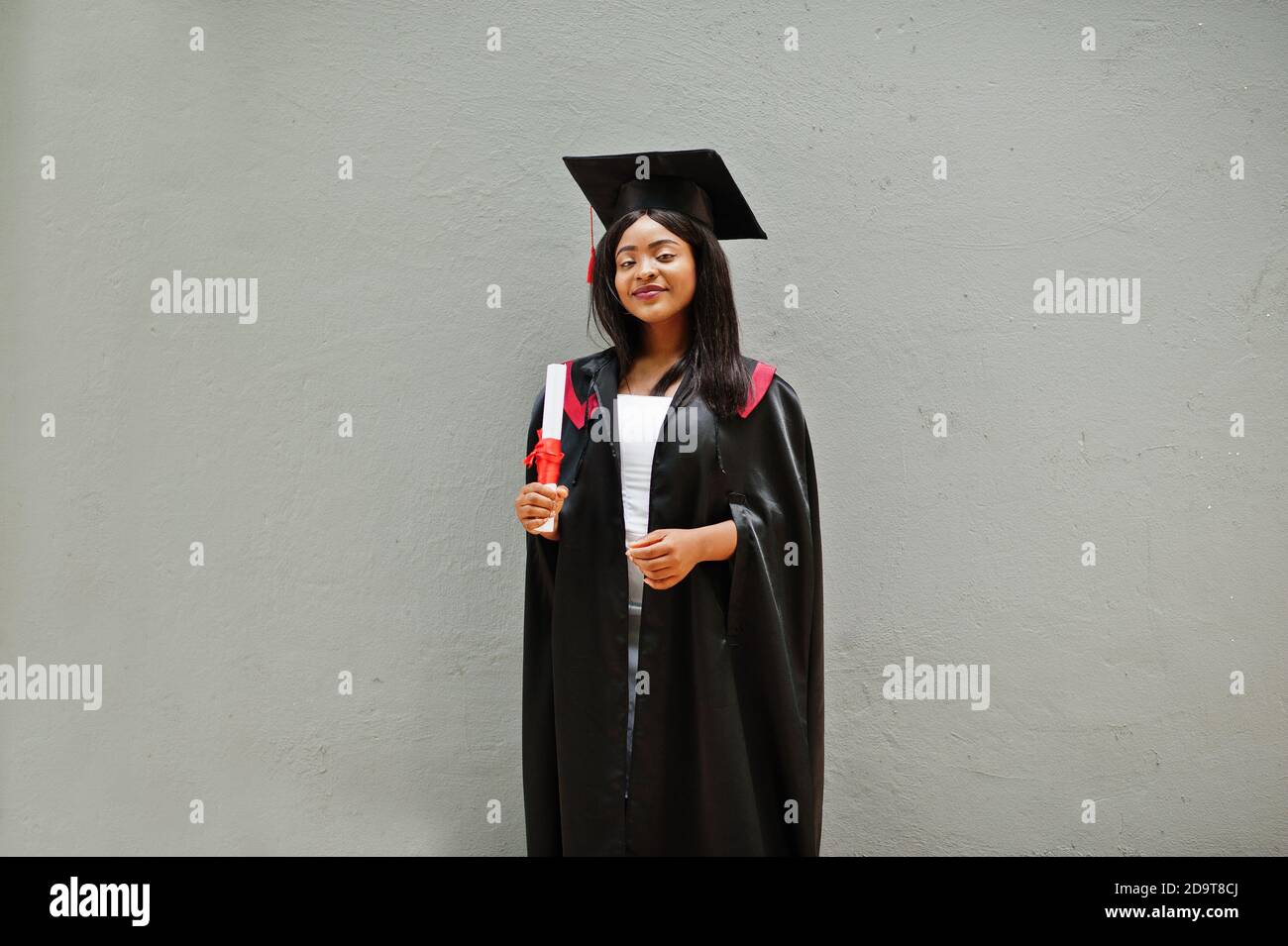 Young female african american student with diploma poses outdoors Stock ...