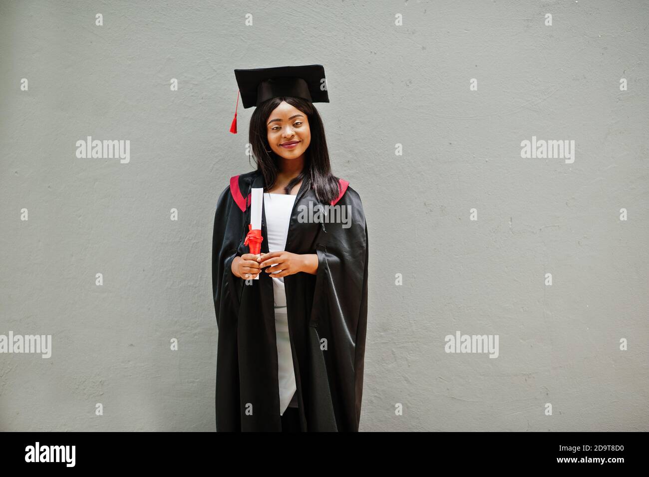 Young female african american student with diploma poses outdoors Stock ...