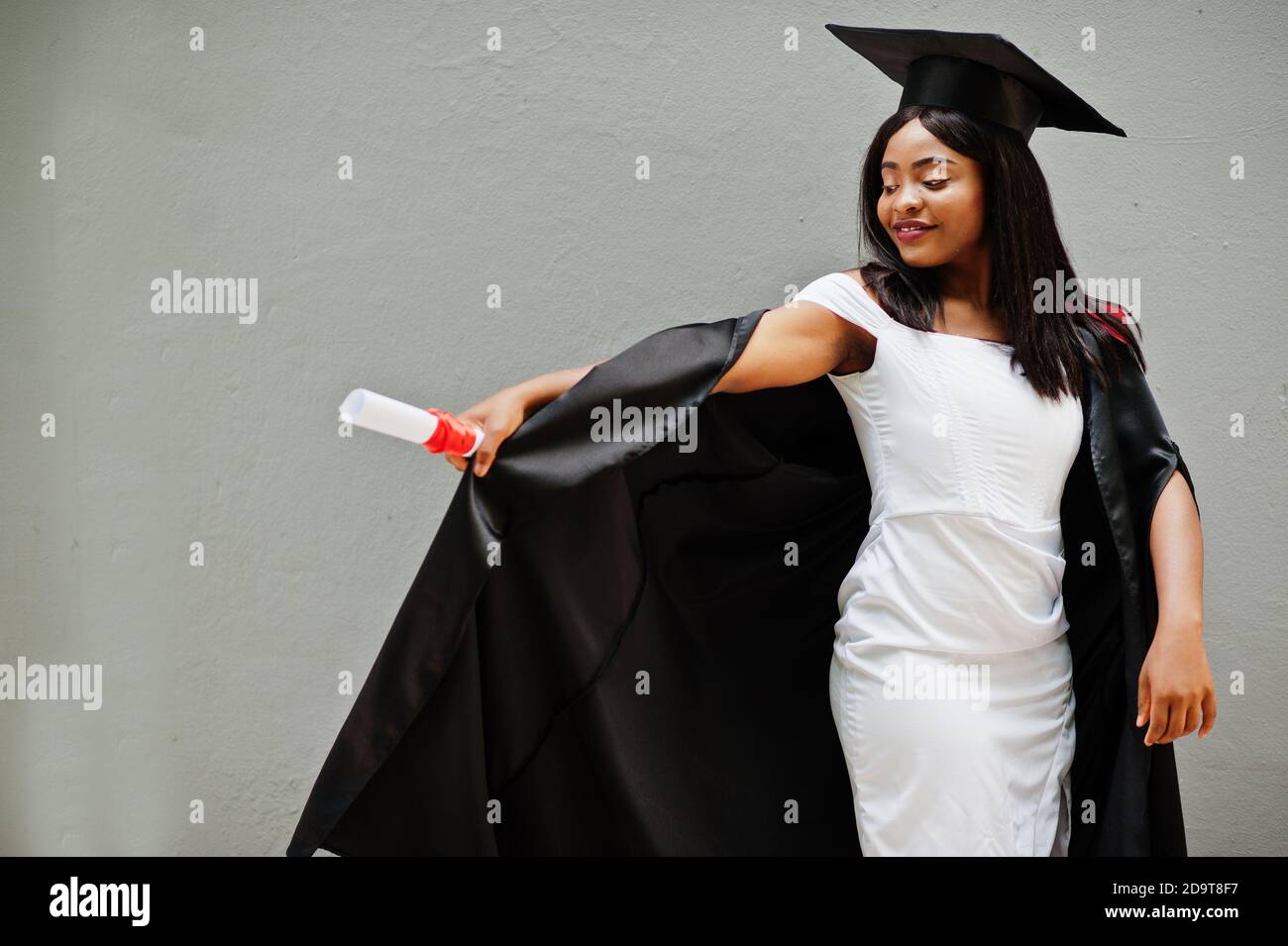 Young female african american student with diploma poses outdoors Stock ...