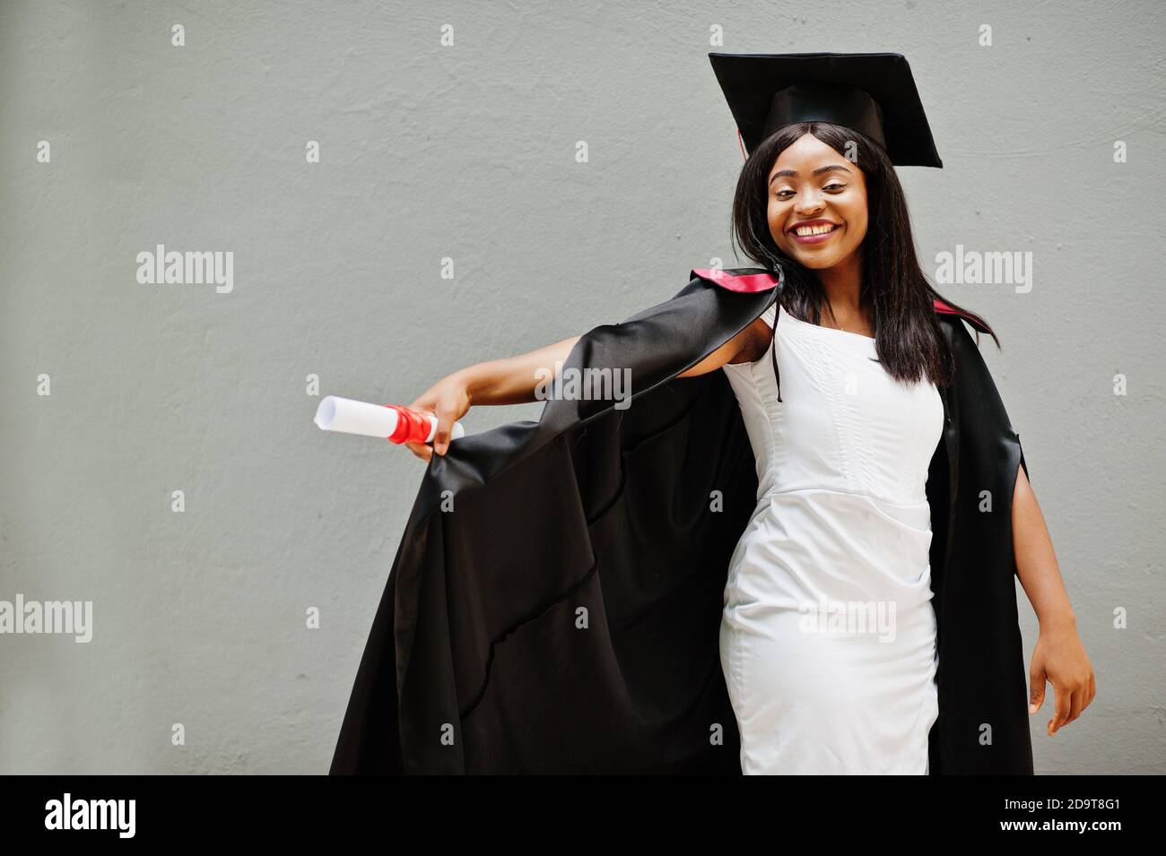 Young female african american student with diploma poses outdoors Stock ...