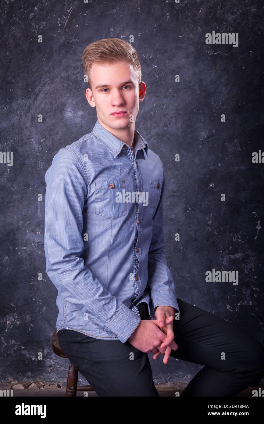 Cute young man dressed in casual studio portrait Stock Photo - Alamy