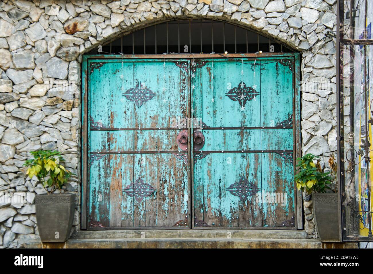 Weathered old turquoise gate Stock Photo - Alamy