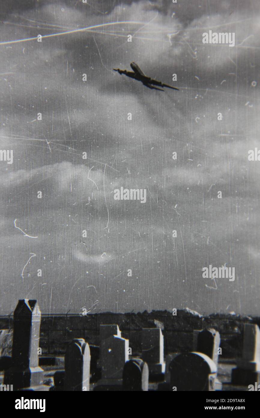Fine 1970s vintage black and white photography of a plane flying over a ...
