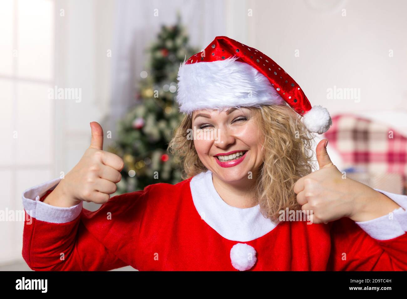 Woman dressed in santa hi-res stock photography and images - Alamy