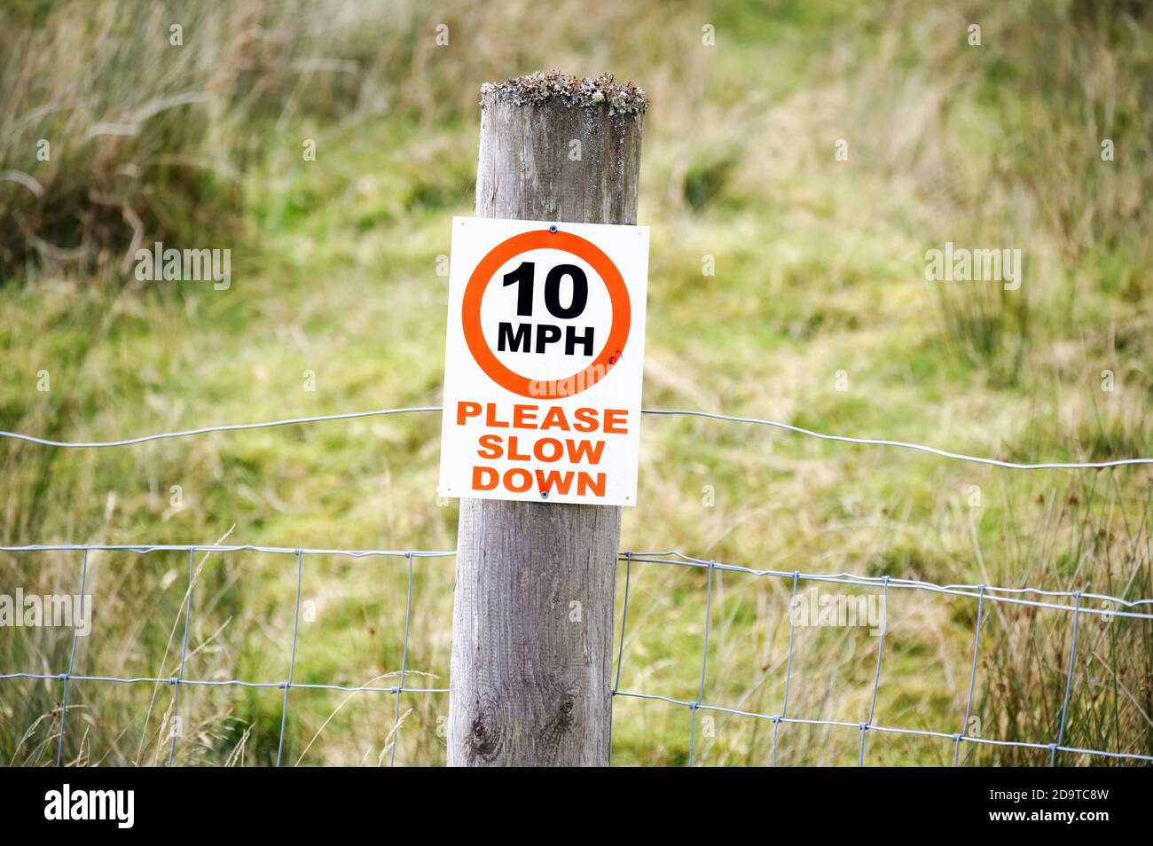 Speed limit sign in rural countryside on post Stock Photo - Alamy