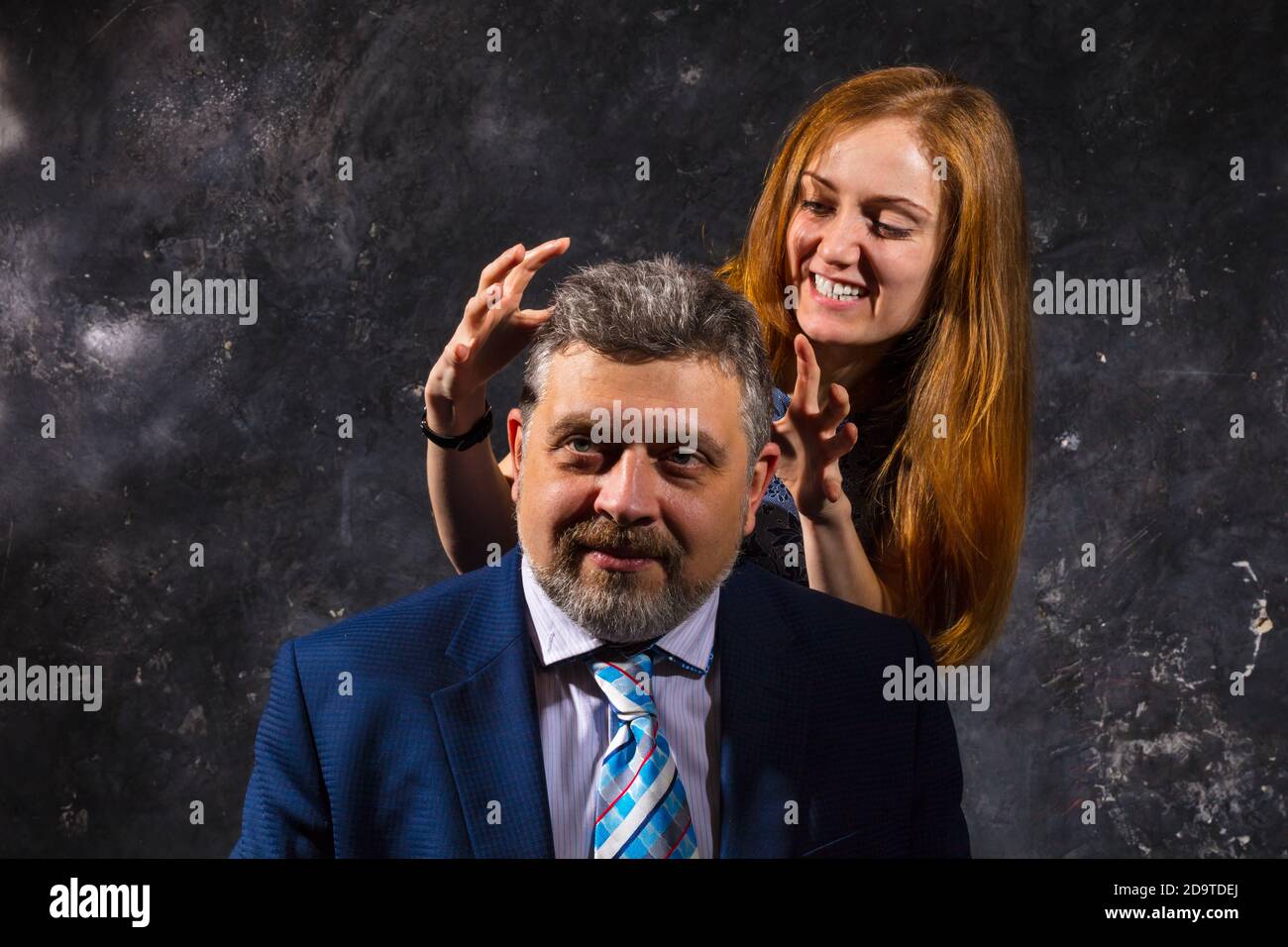 Happy couple have some fun studio portrait Stock Photo - Alamy