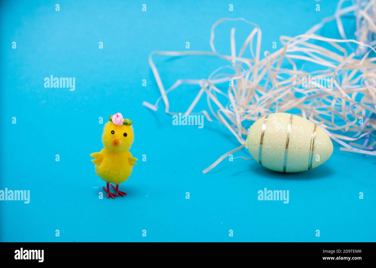 Easter eggs and chiks on blue background Stock Photo - Alamy