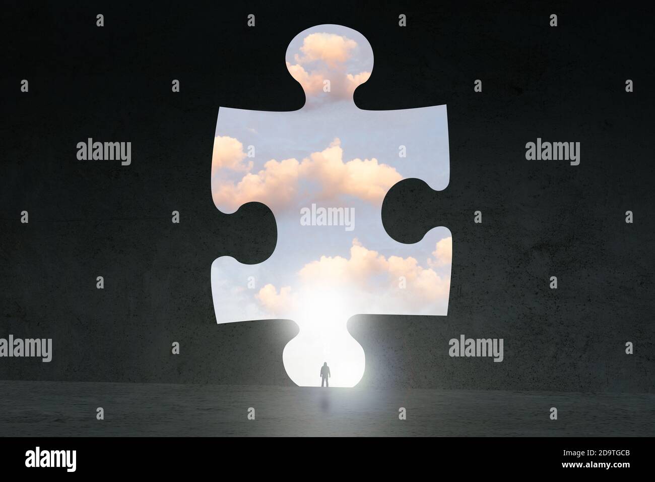 A puzzle concept, of a man silhouetted against a jigsaw puzzle and ...