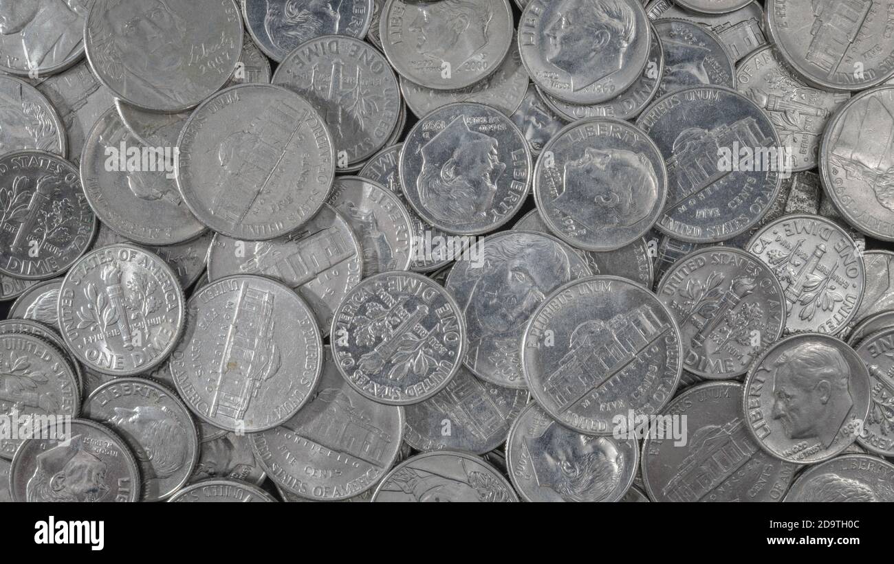 Close shot mass of U.S. nickels and dimes coins. For cheap, low-paying ...