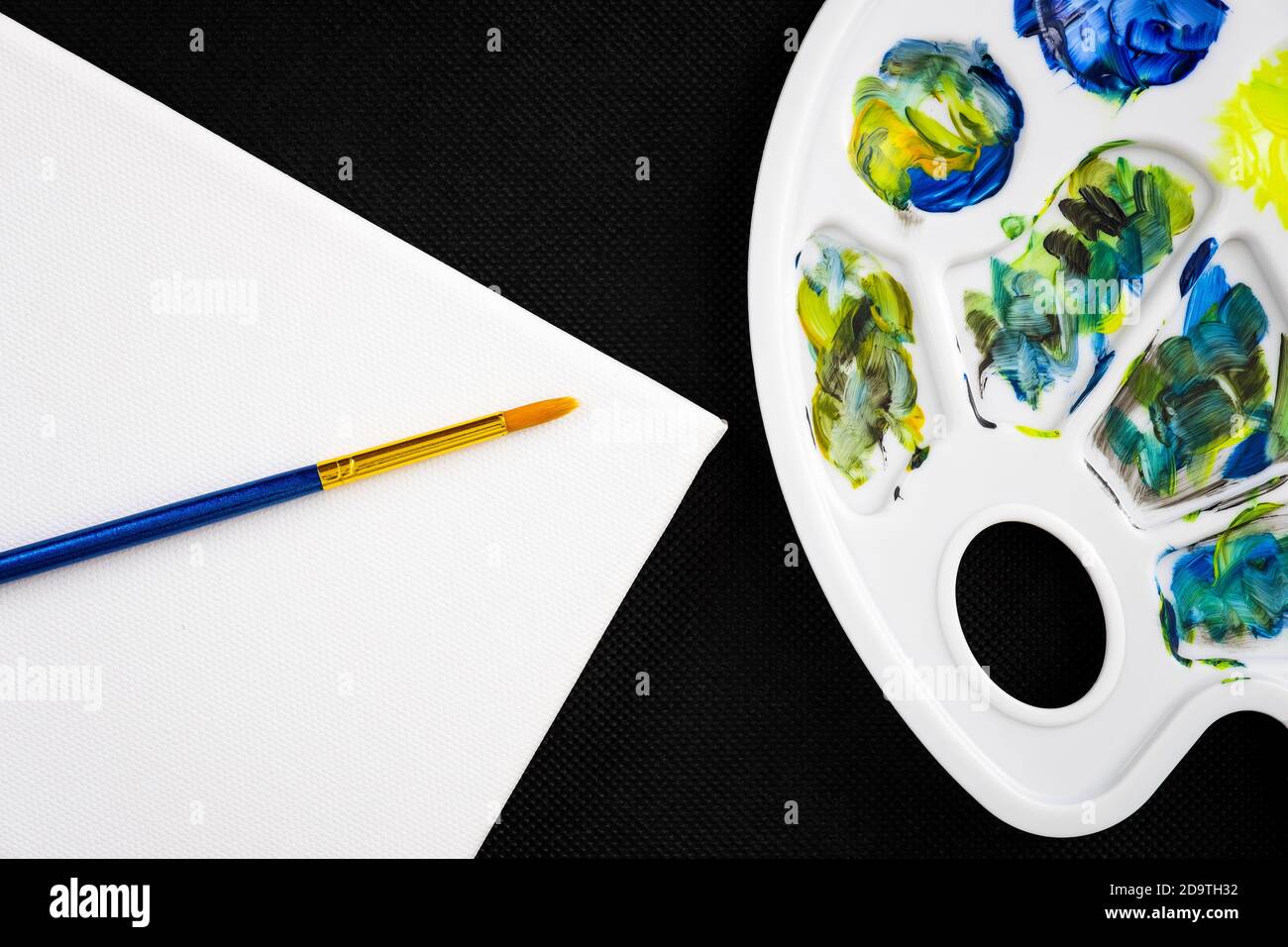 Close-up picture of simple set of tools and colors for painting on ...
