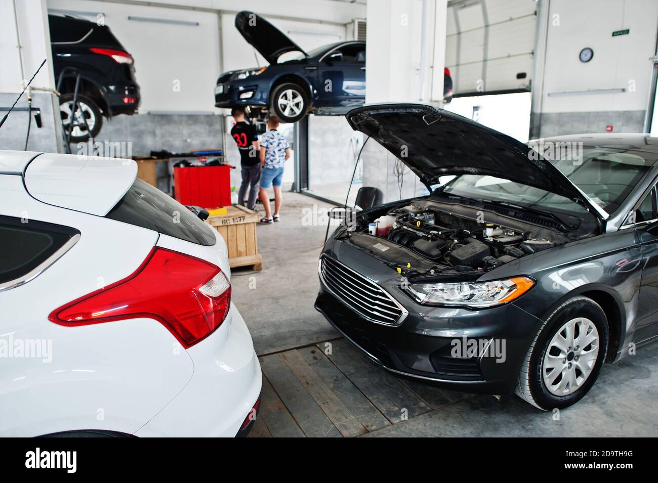 Car repair and maintenance theme. Cars in auto service Stock Photo - Alamy