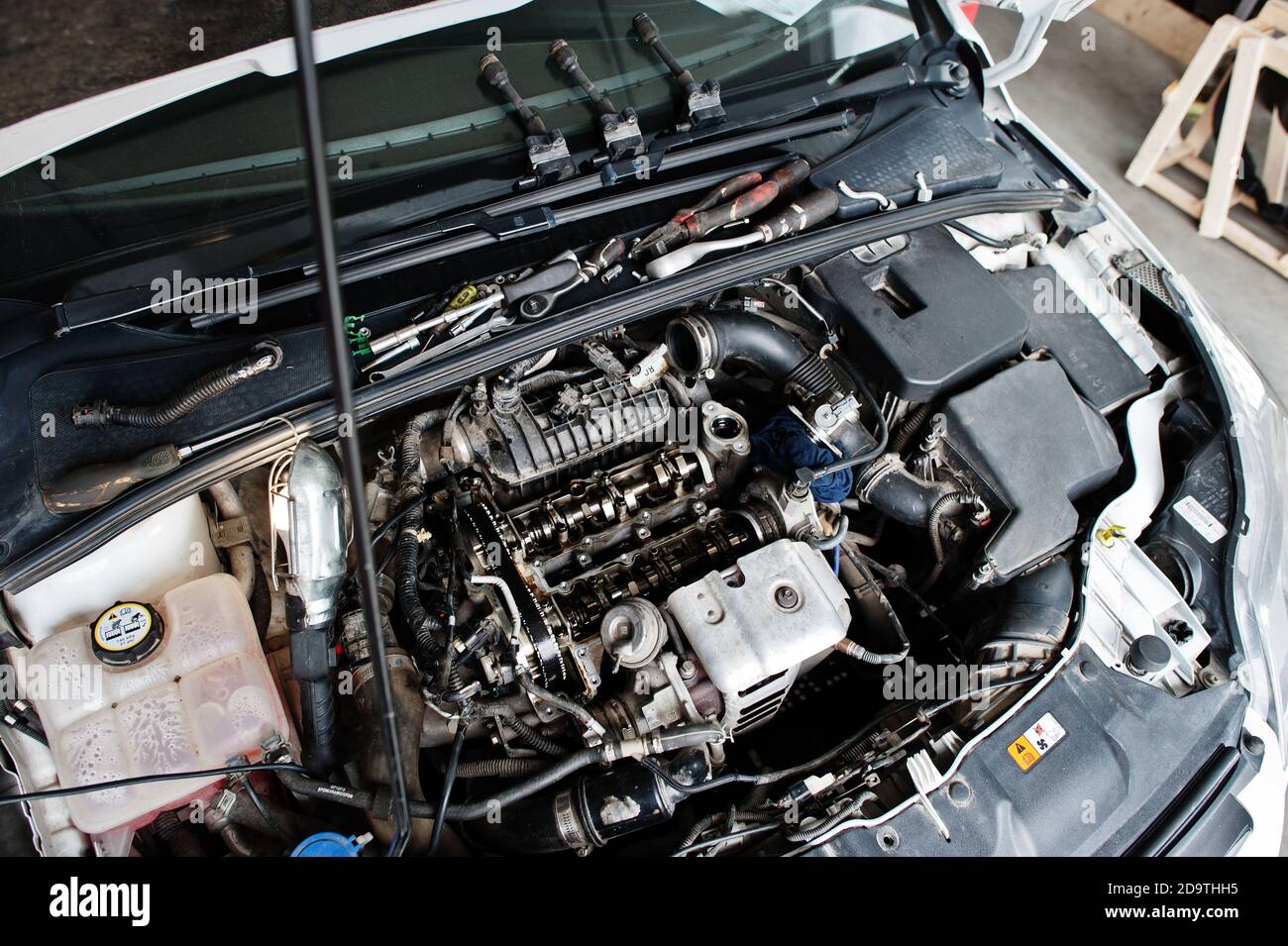 Car repair and maintenance theme. Open hood engine in auto service ...