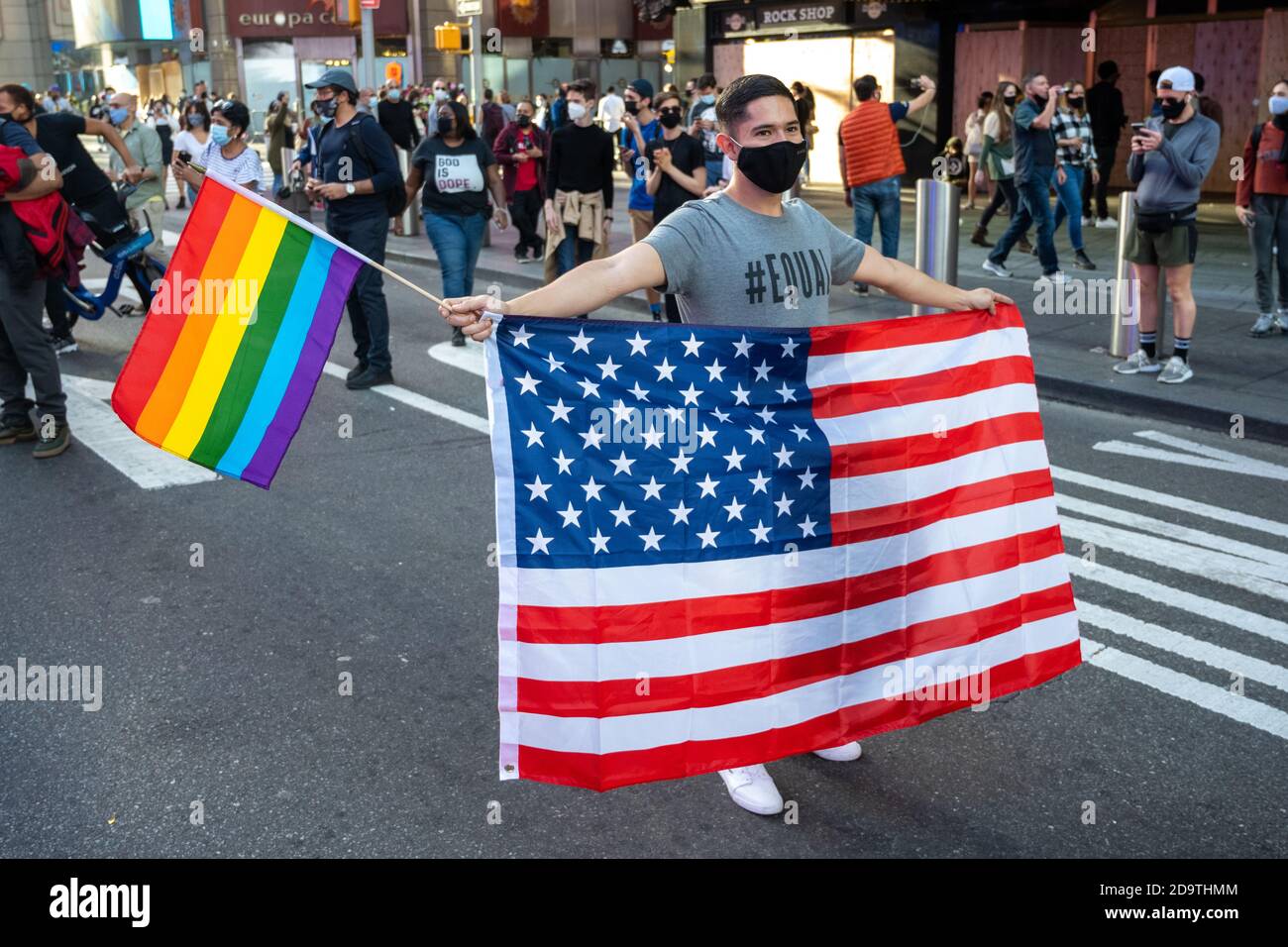 New York, USA. 7th Nov, 2020. People wear face masks as they celebrate ...