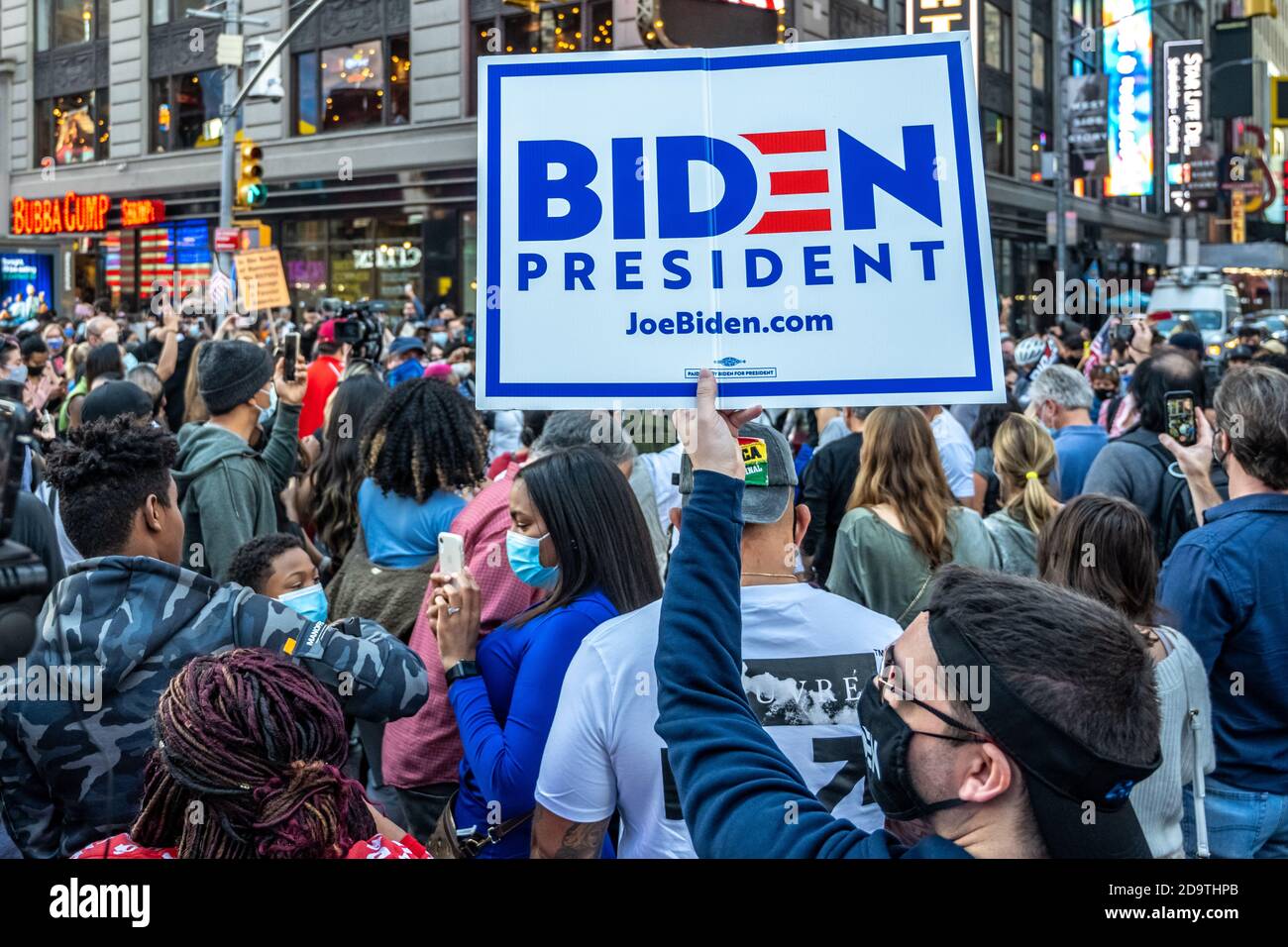 New York, USA. 7th Nov, 2020. People wear face masks as they celebrate ...